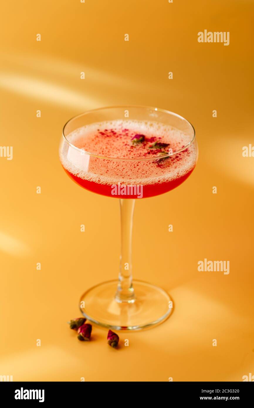 Pink Raspberry Cocktail in drink glass Stock Photo - Alamy