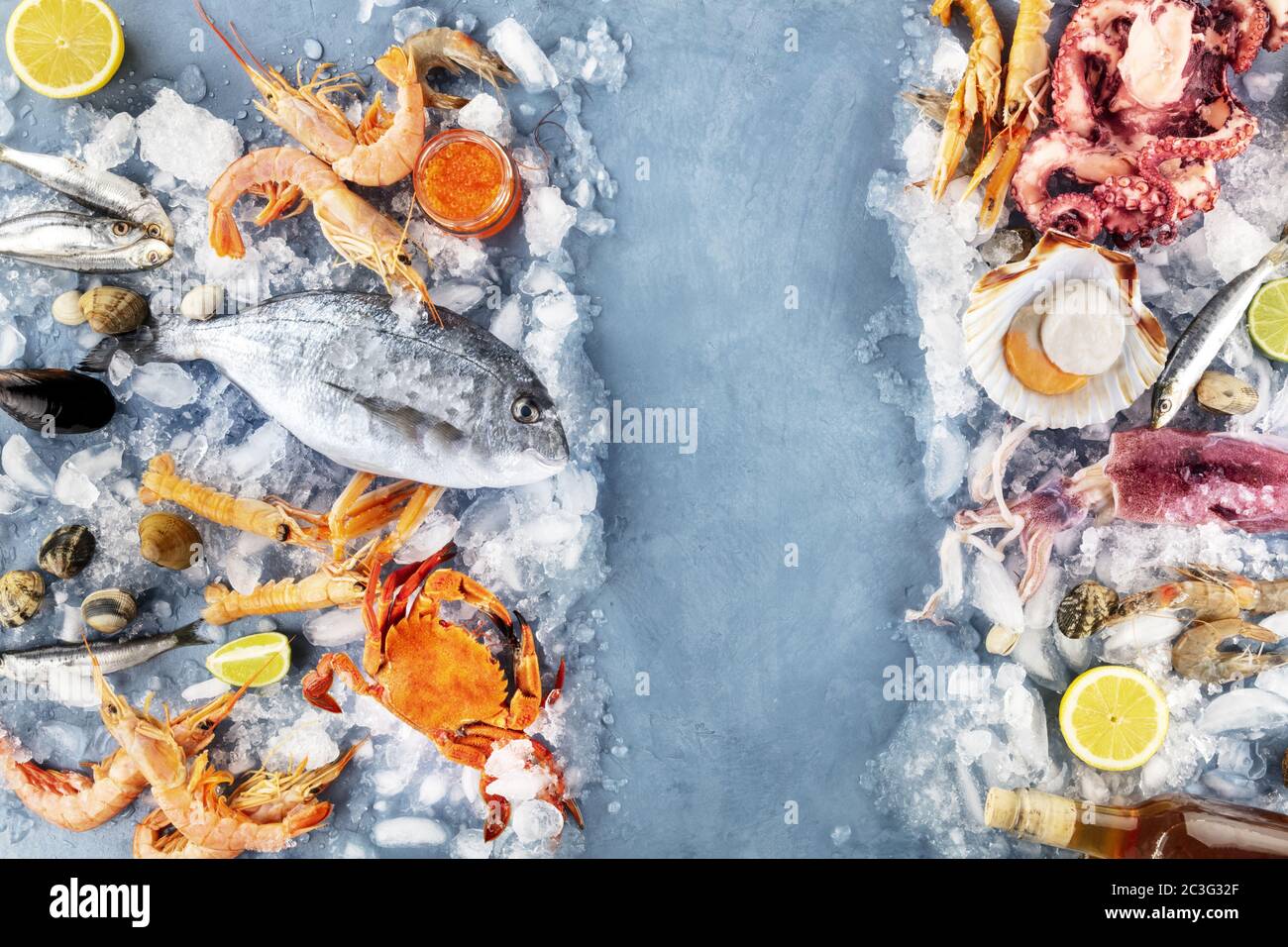 Fish and seafood background with copy space. Sea bream, scallop ...