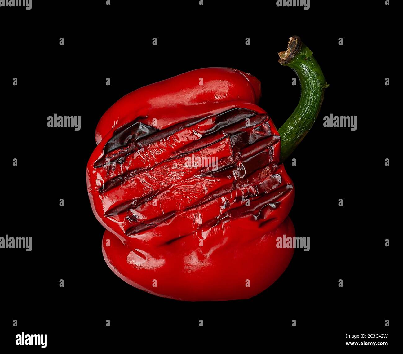 Grilled red pepper on black background Stock Photo - Alamy