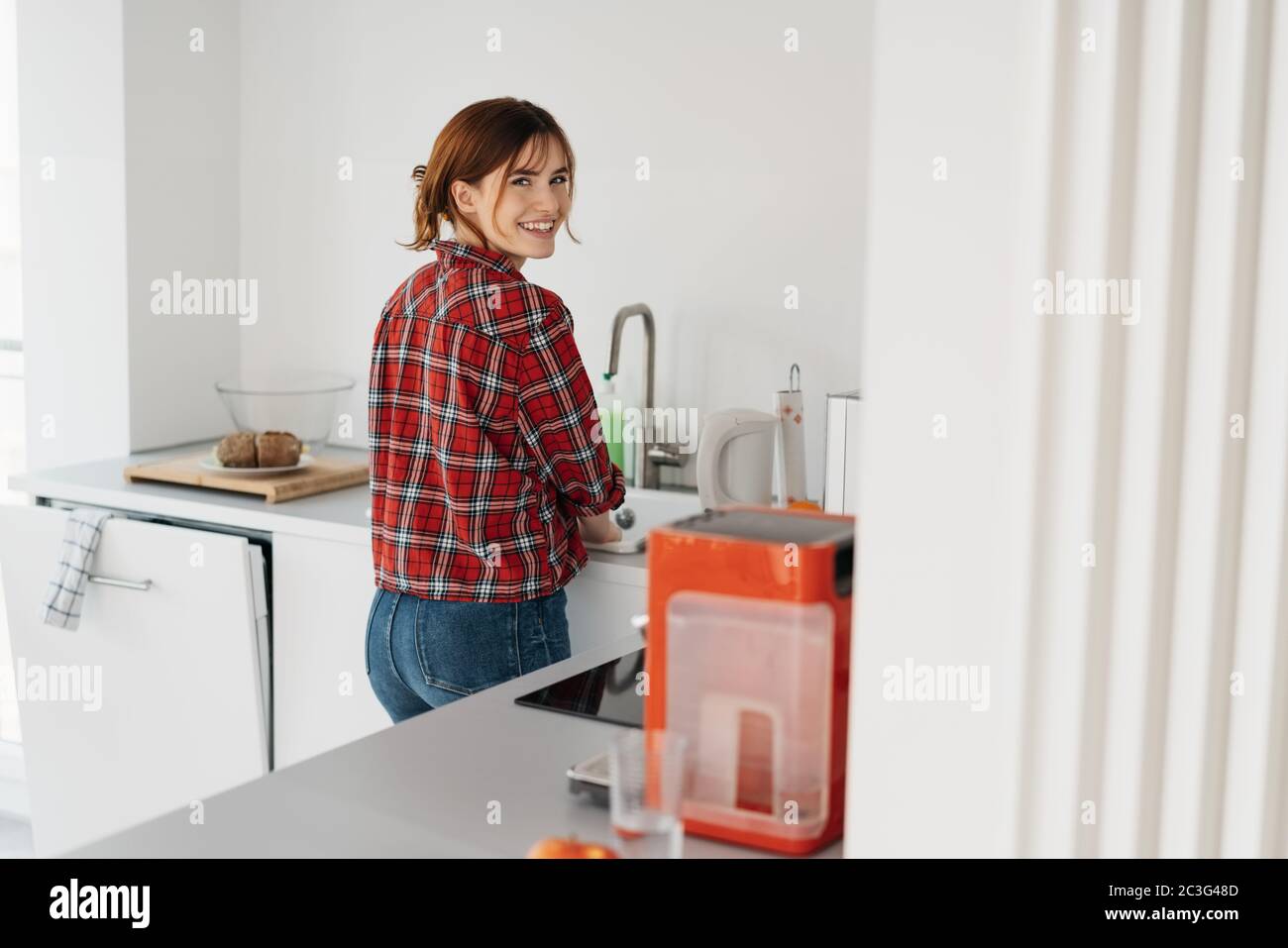 Standing at sink washing up hi-res stock photography and images - Alamy