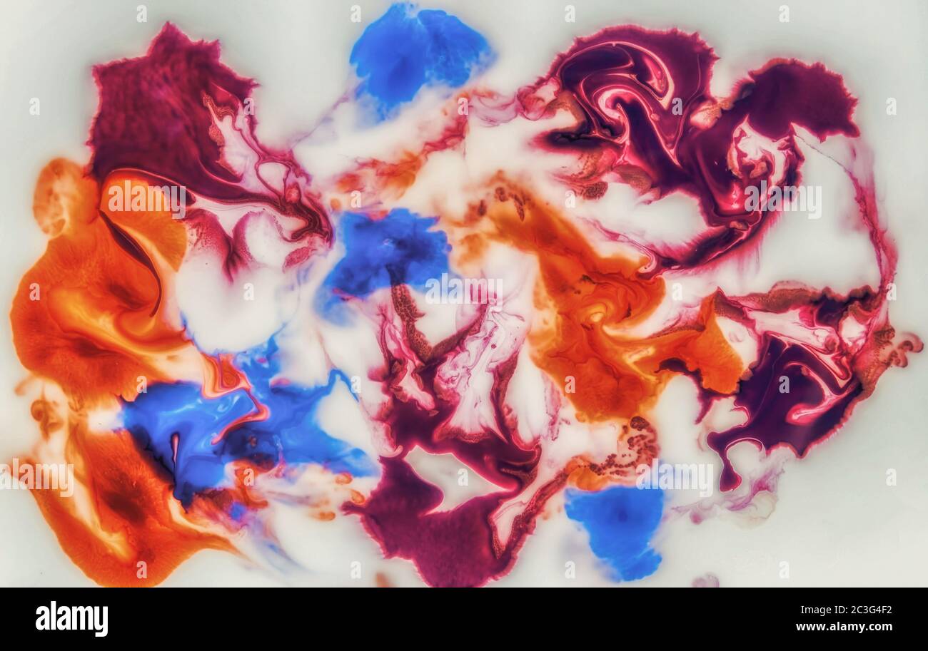 Ink flowing and mixing with milk Stock Photo - Alamy