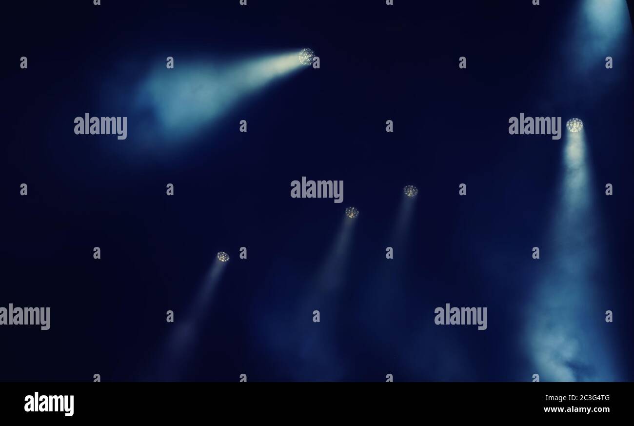 projectors light beam through smoke Stock Photo - Alamy