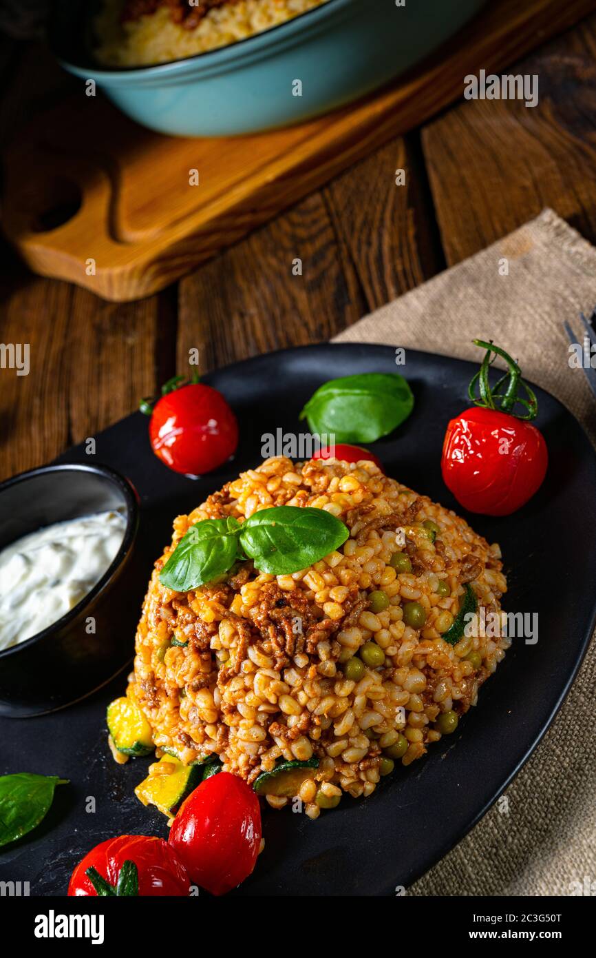 rustic bulgur fried with minced meat and vegetables Stock Photo - Alamy