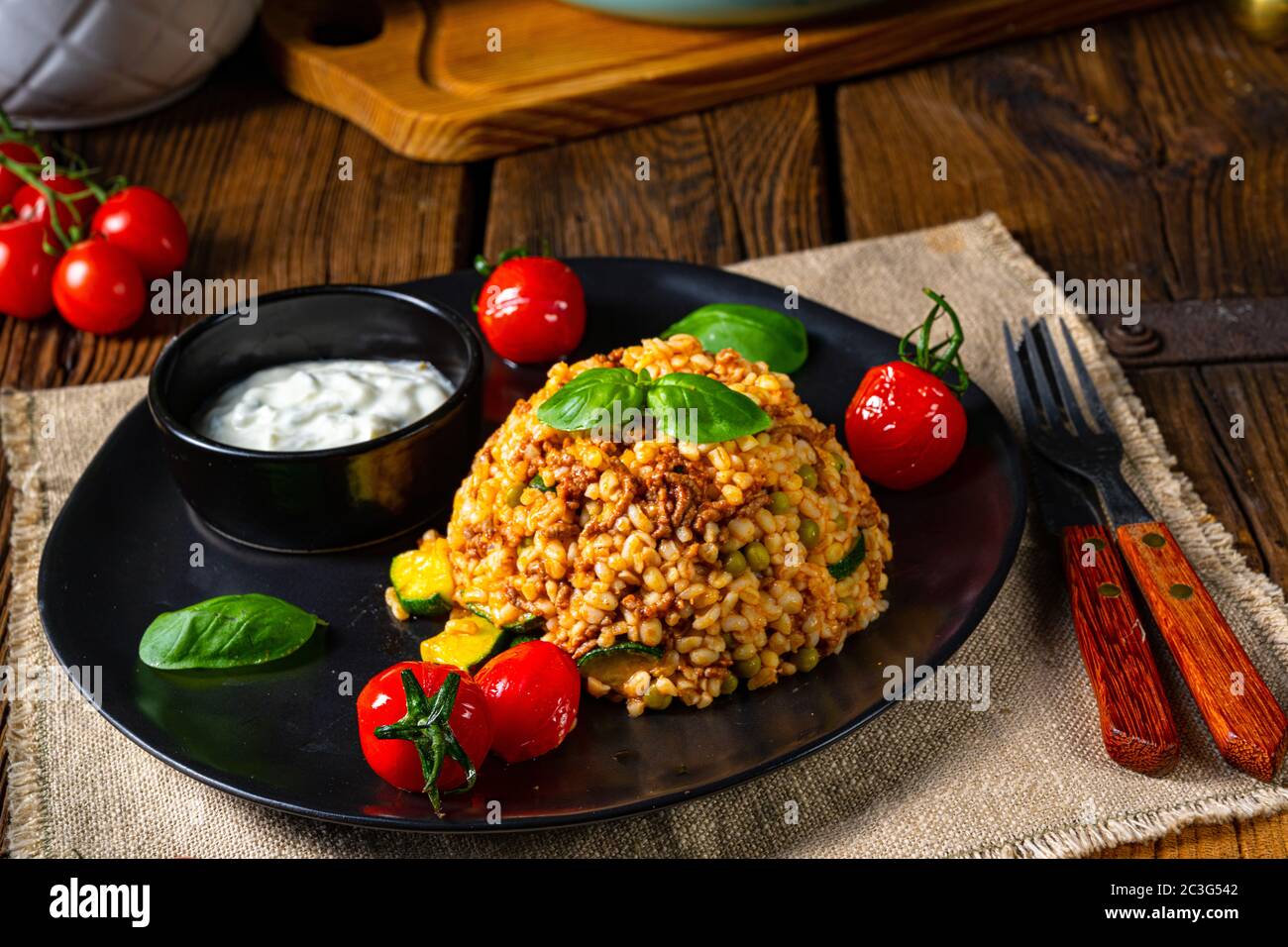 rustic bulgur fried with minced meat and vegetables Stock Photo - Alamy