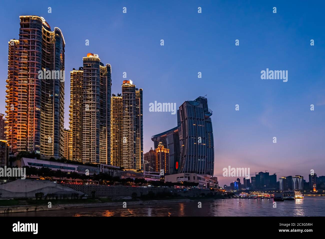 Riverside buildings in Chongqing city at sunset Stock Photo - Alamy