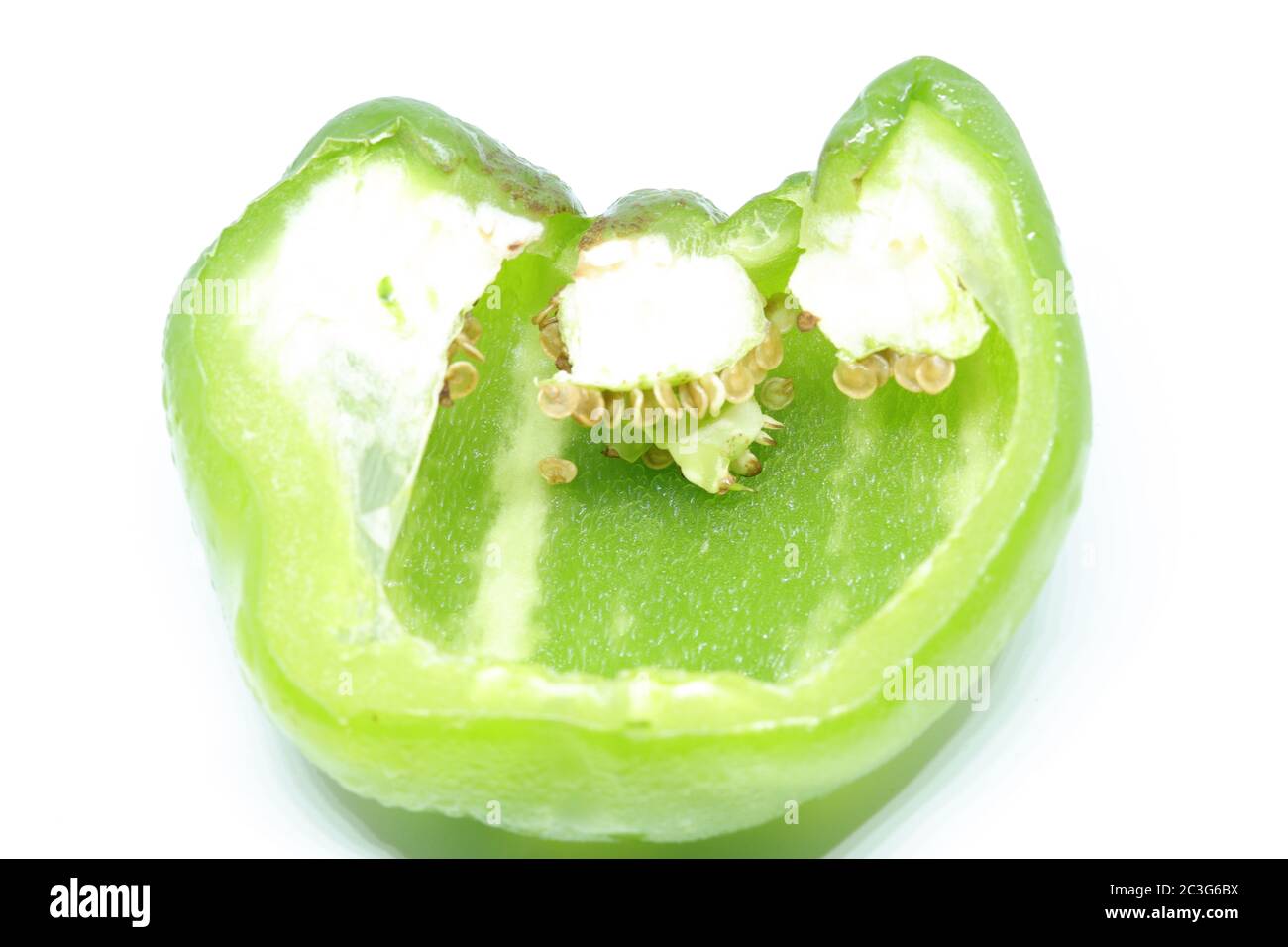 slice of green bell pepper or capsicum isolated on white background ...