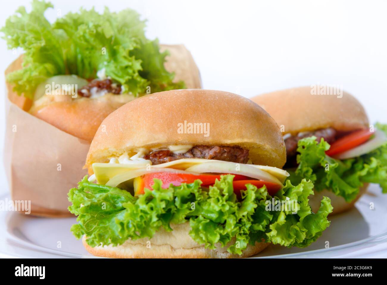 Group of three hamburger on a white background Stock Photo - Alamy