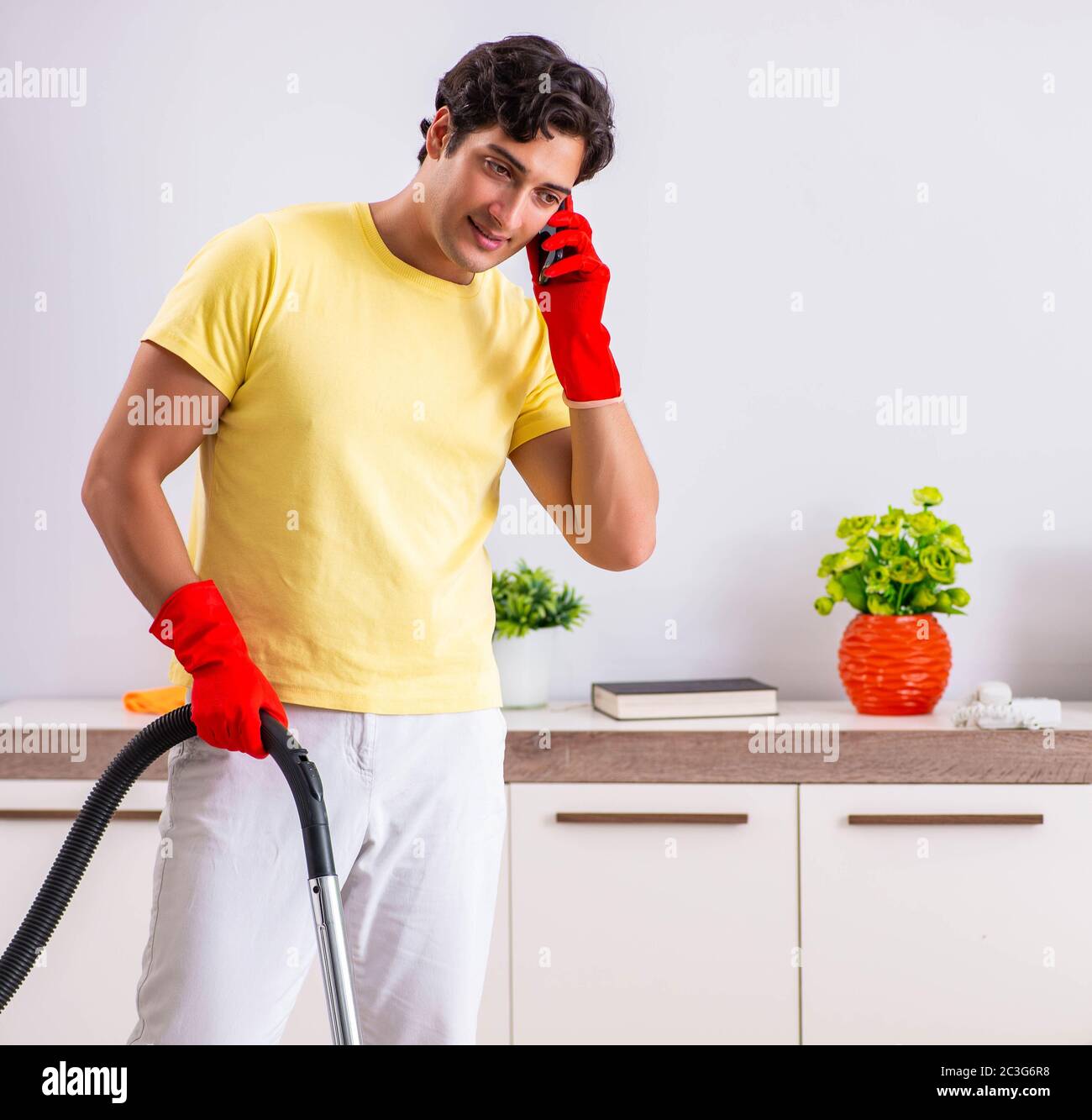 Man vacuuming bed hi-res stock photography and images - Alamy
