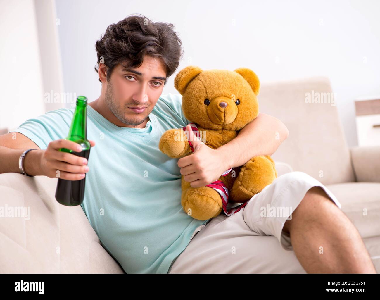 Young drunk handsome man after party at home Stock Photo - Alamy