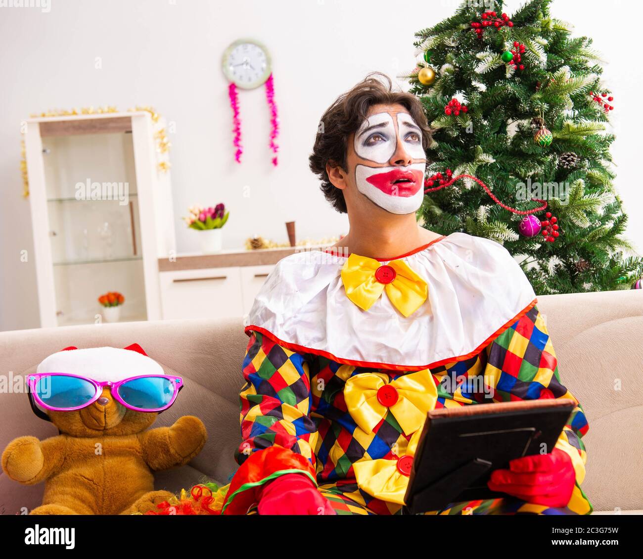 Funny clown in Christmas celebration concept Stock Photo - Alamy