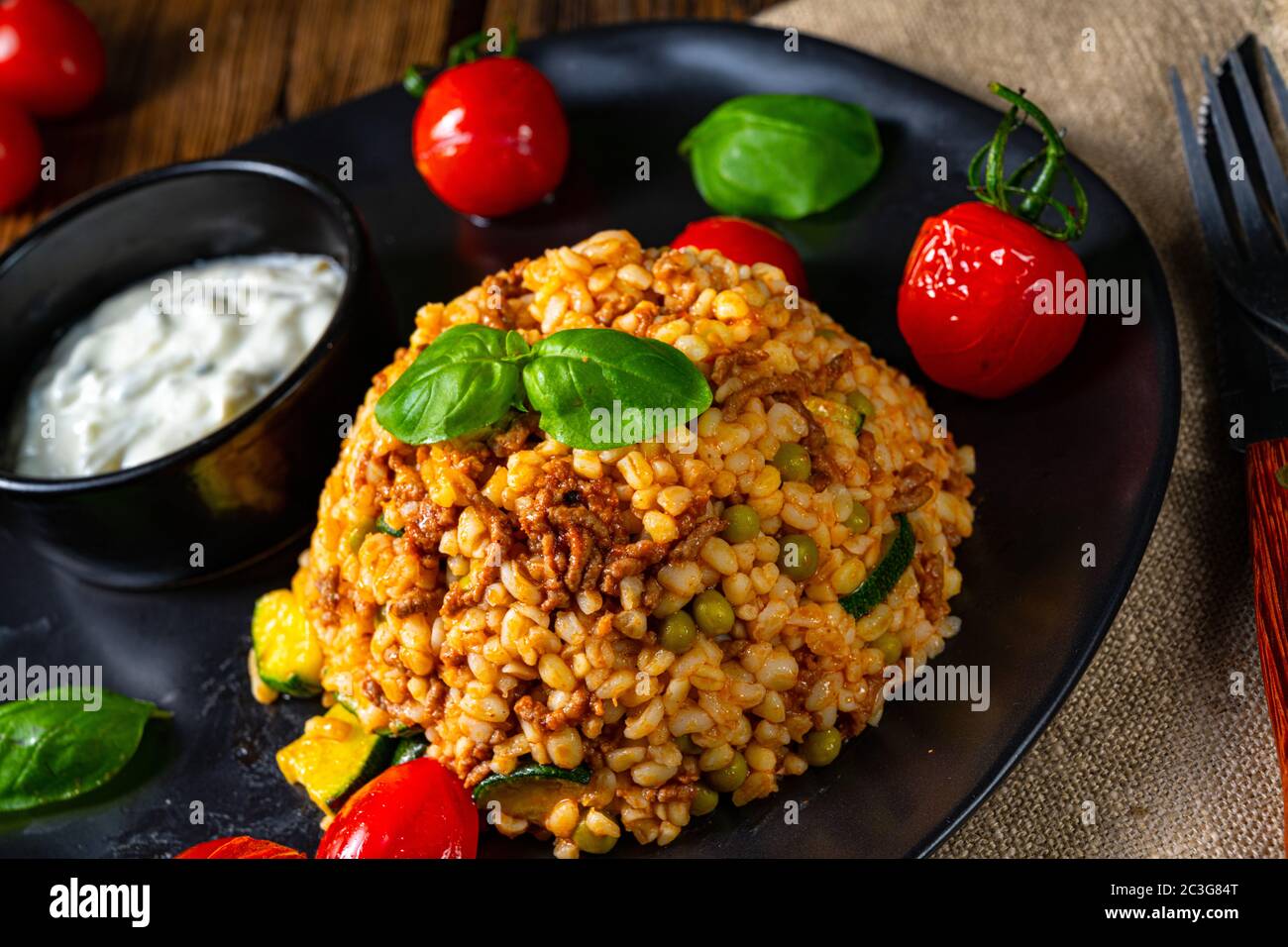 rustic bulgur fried with minced meat and vegetables Stock Photo - Alamy