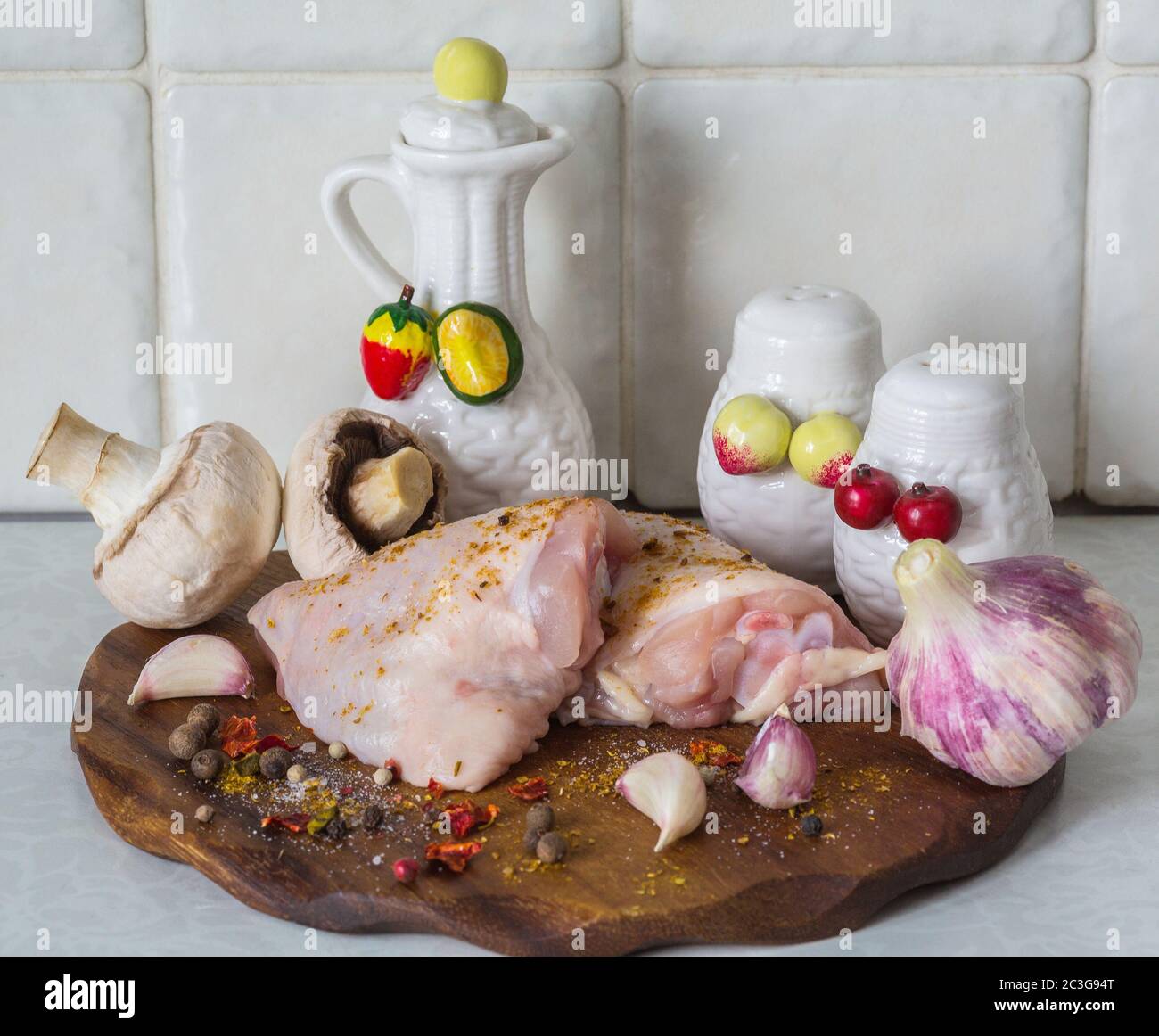 Raw chicken thigh Stock Photo - Alamy