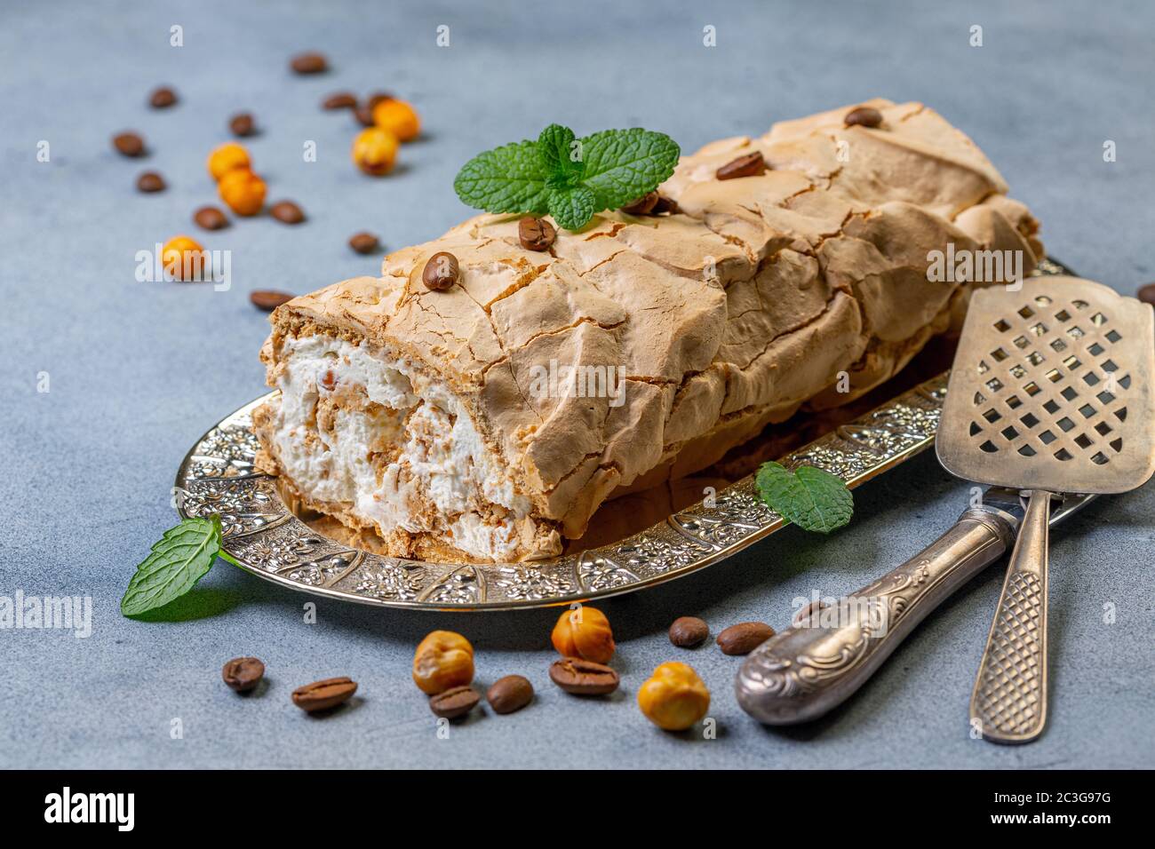 Coffee meringue roulade with mascarpone and whipped cream Stock Photo ...