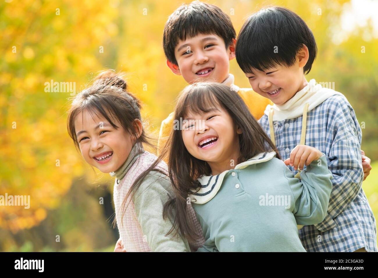Laugh a lot of boys and girls Stock Photo - Alamy