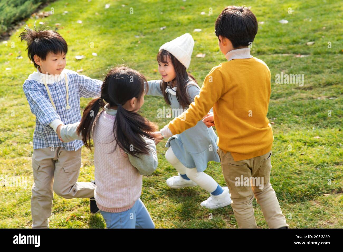 Happy children playing in the park Stock Photo - Alamy