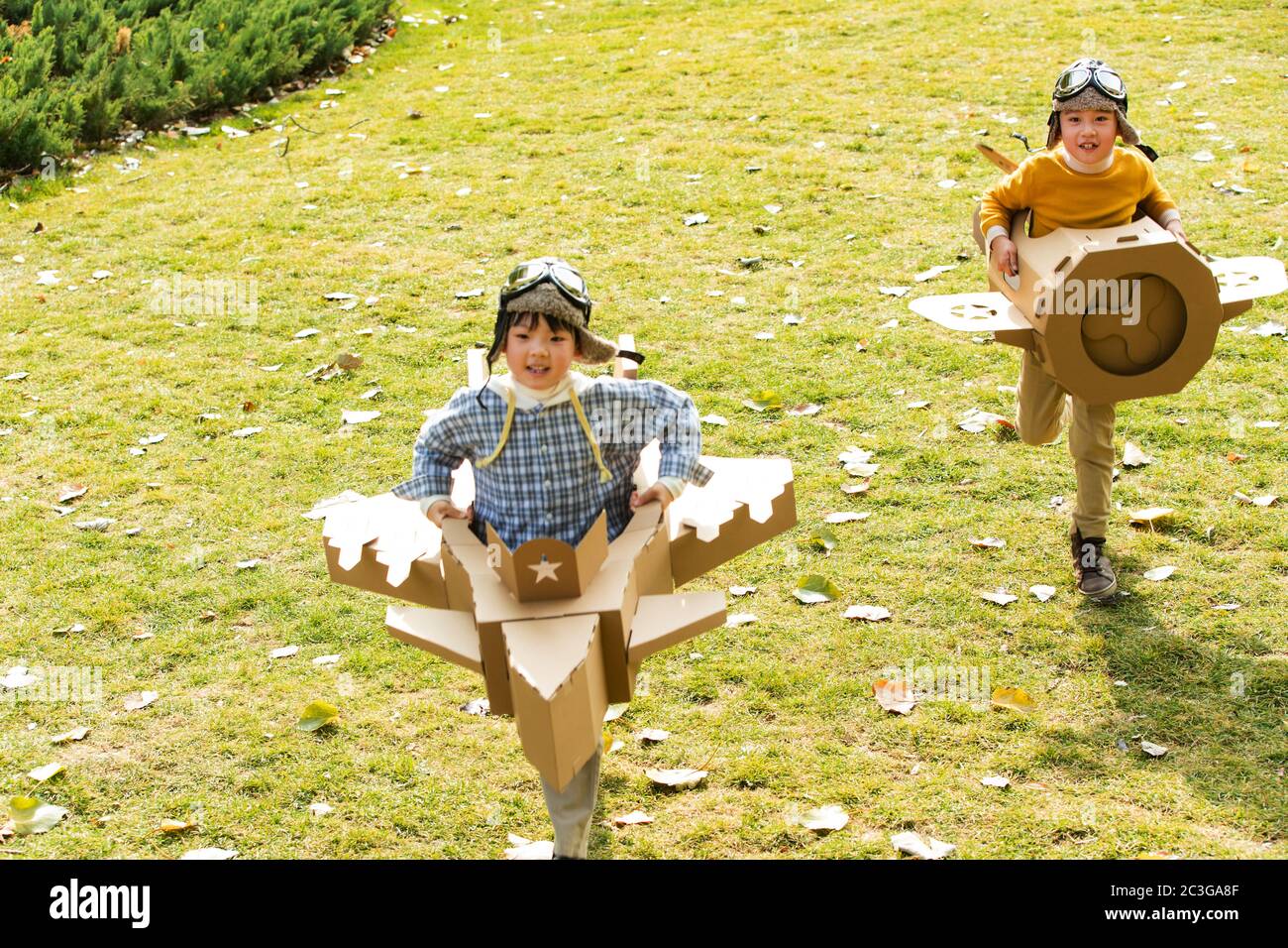 Two boys play to fly Stock Photo - Alamy