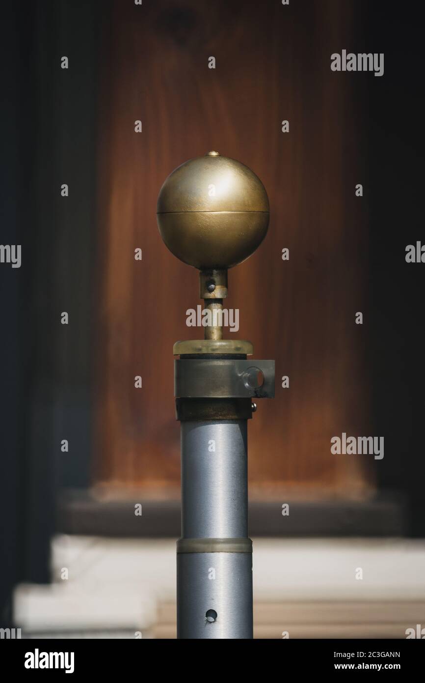 Bronze Post with Wood Background Stock Photo - Alamy