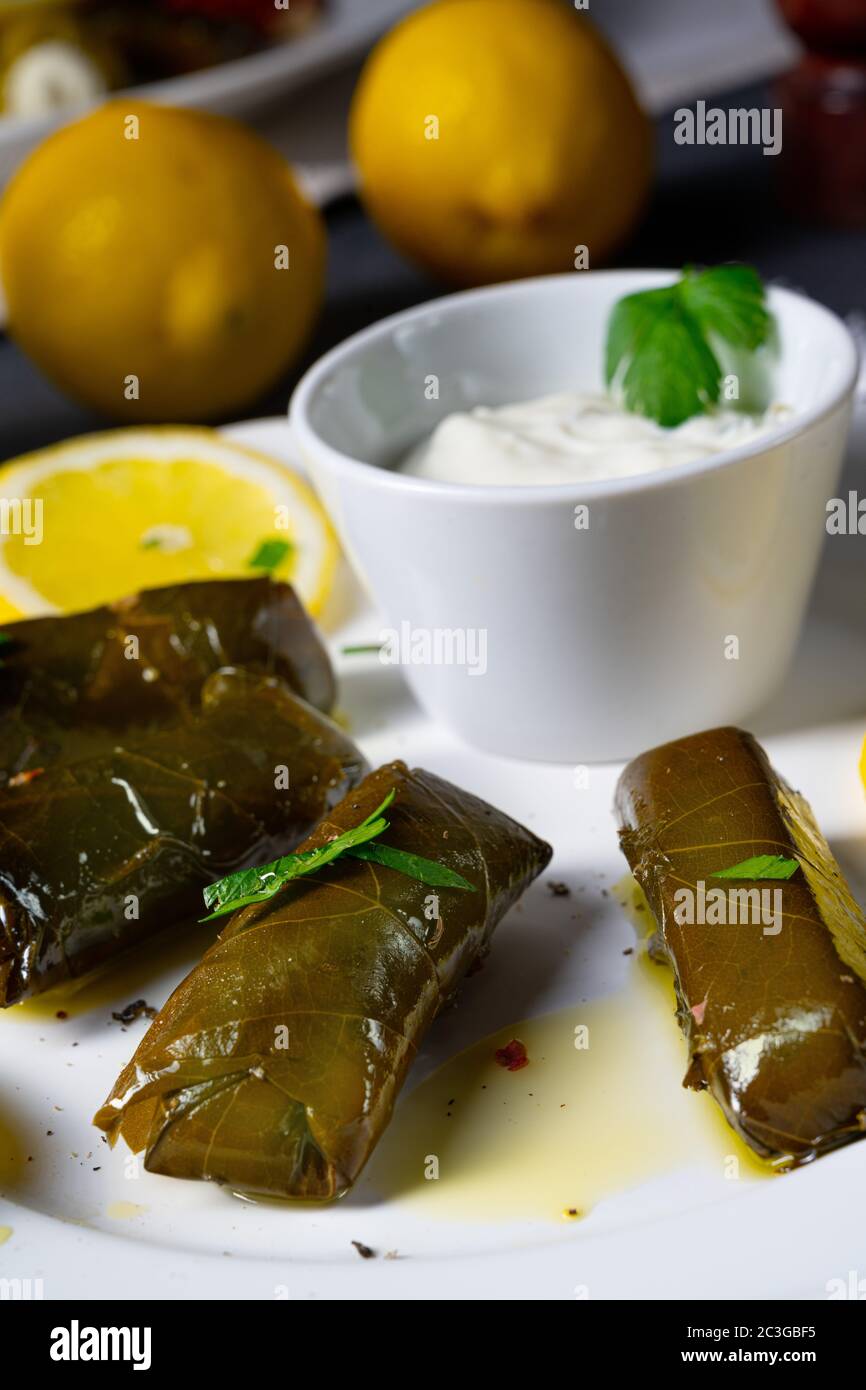 Dolmades - stuffed grape leaves the Greek way Stock Photo - Alamy
