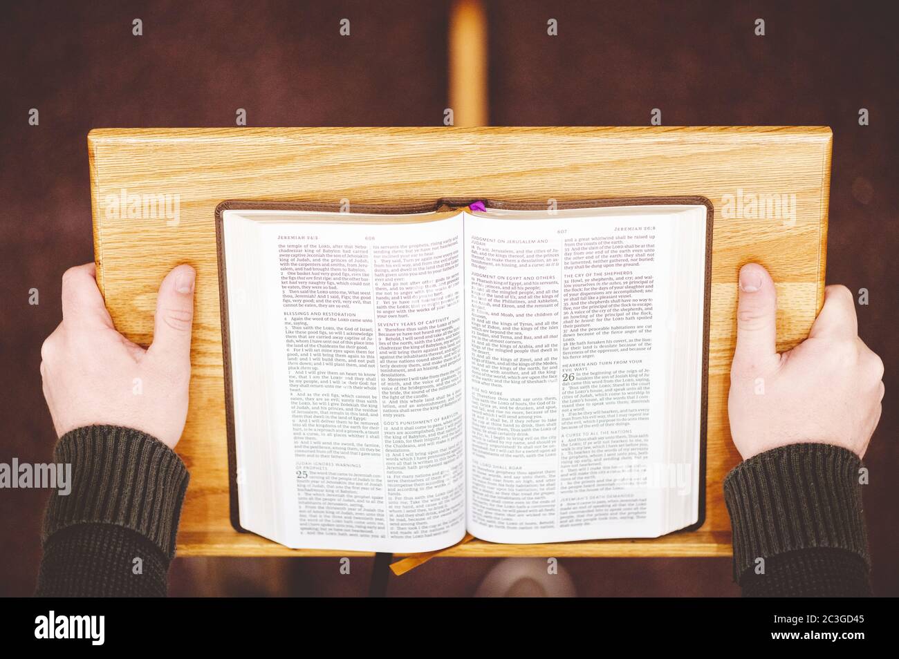 High angle shot of a person preaching the Holy Bible from the tribune ...