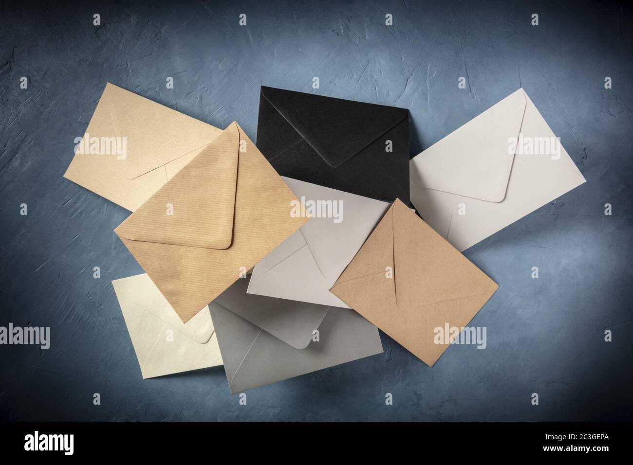 C6 envelopes, brown, gray, and black, flying in the air Stock Photo - Alamy