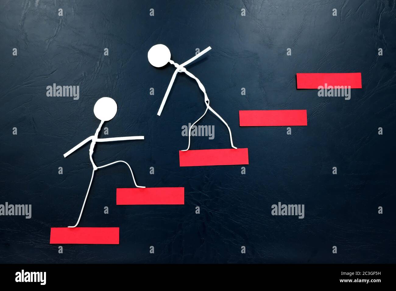 Helping hand, support and teamwork concept. Two human stick figures ...