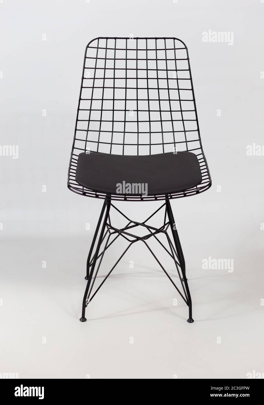 Vertical shot of a futuristic chair with a chain in the back behind a ...