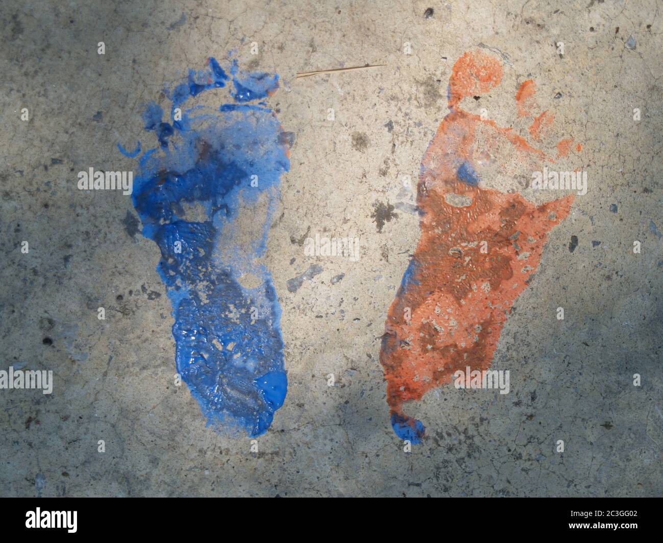 Overhead shot of a red and blue footprint painted on the ground Stock ...