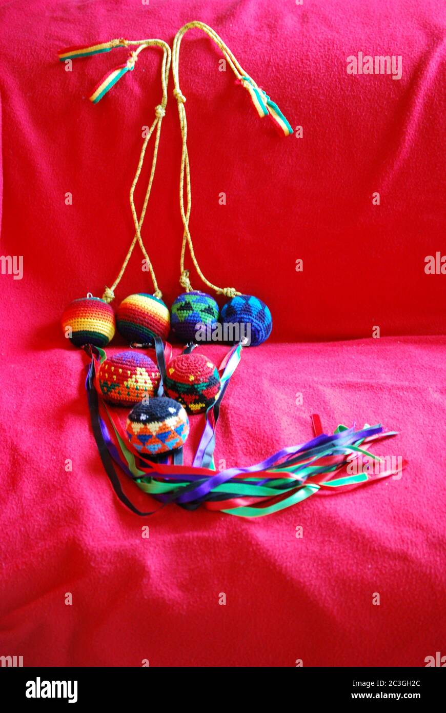 Picture of a colourful handmade necklace on a red background Stock ...