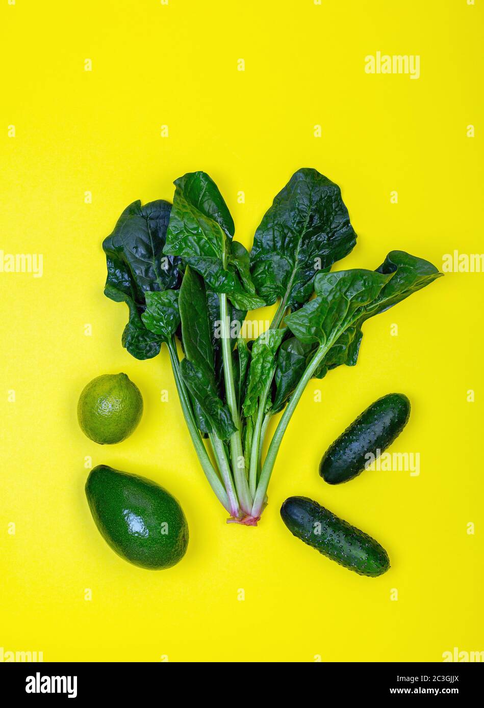 Organic spinach, lime, avocado and cucumbers Stock Photo - Alamy