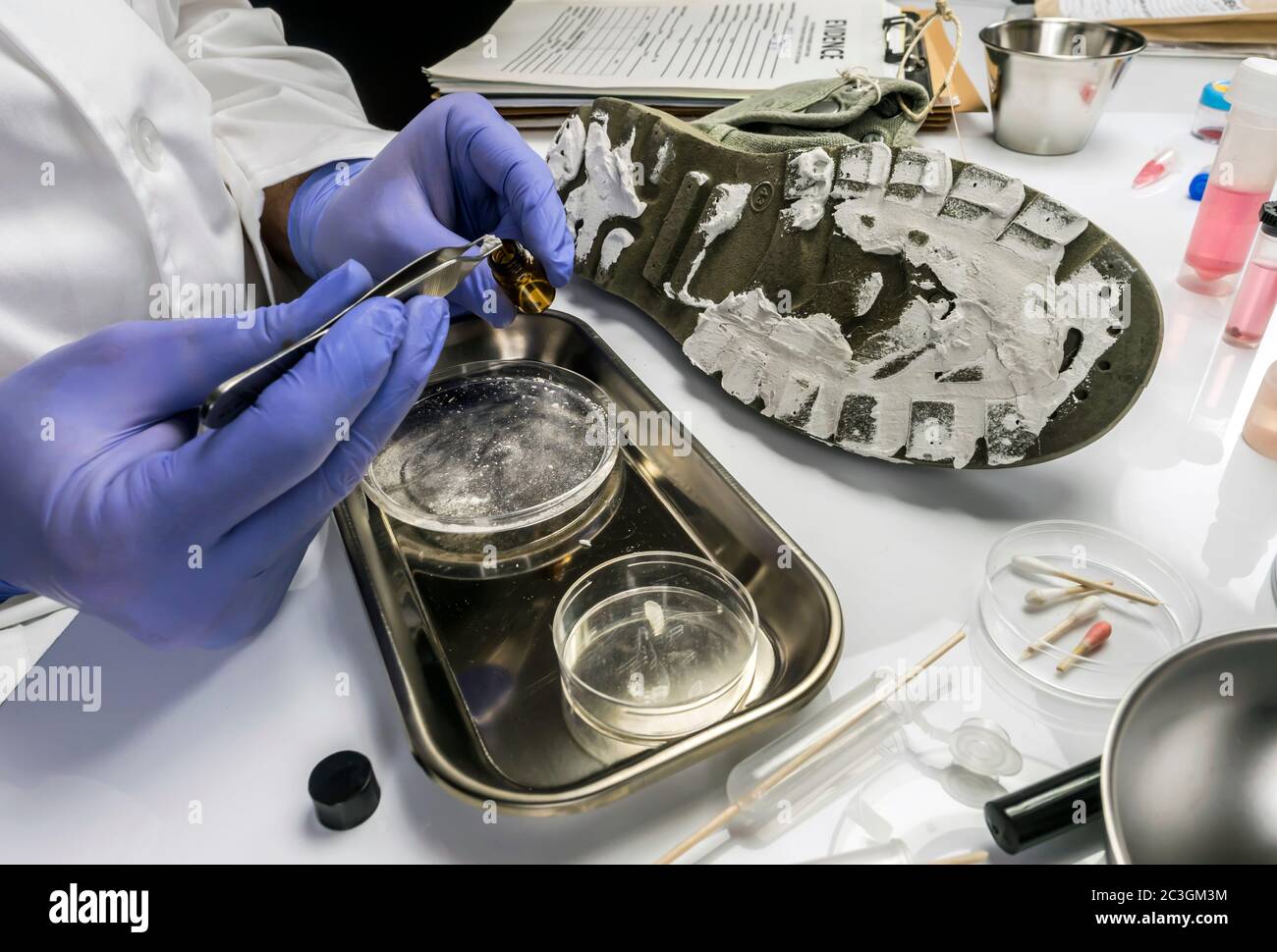 Shoe with cement footprints analyzed in crime lab, crime evidence ...