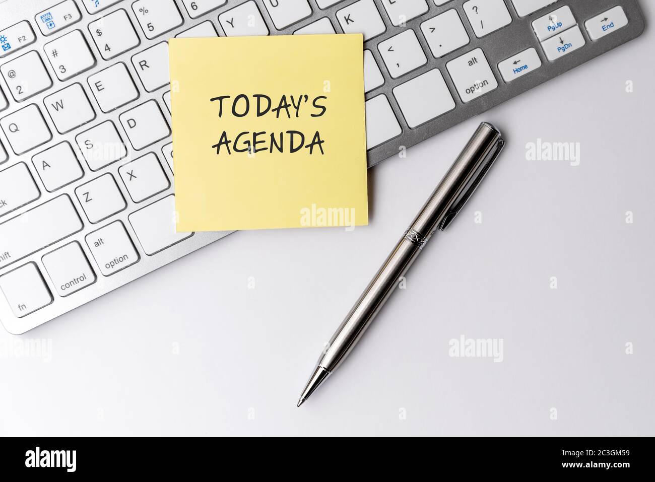 Today's agenda text on sticky note with computer keyboard and pen Stock ...