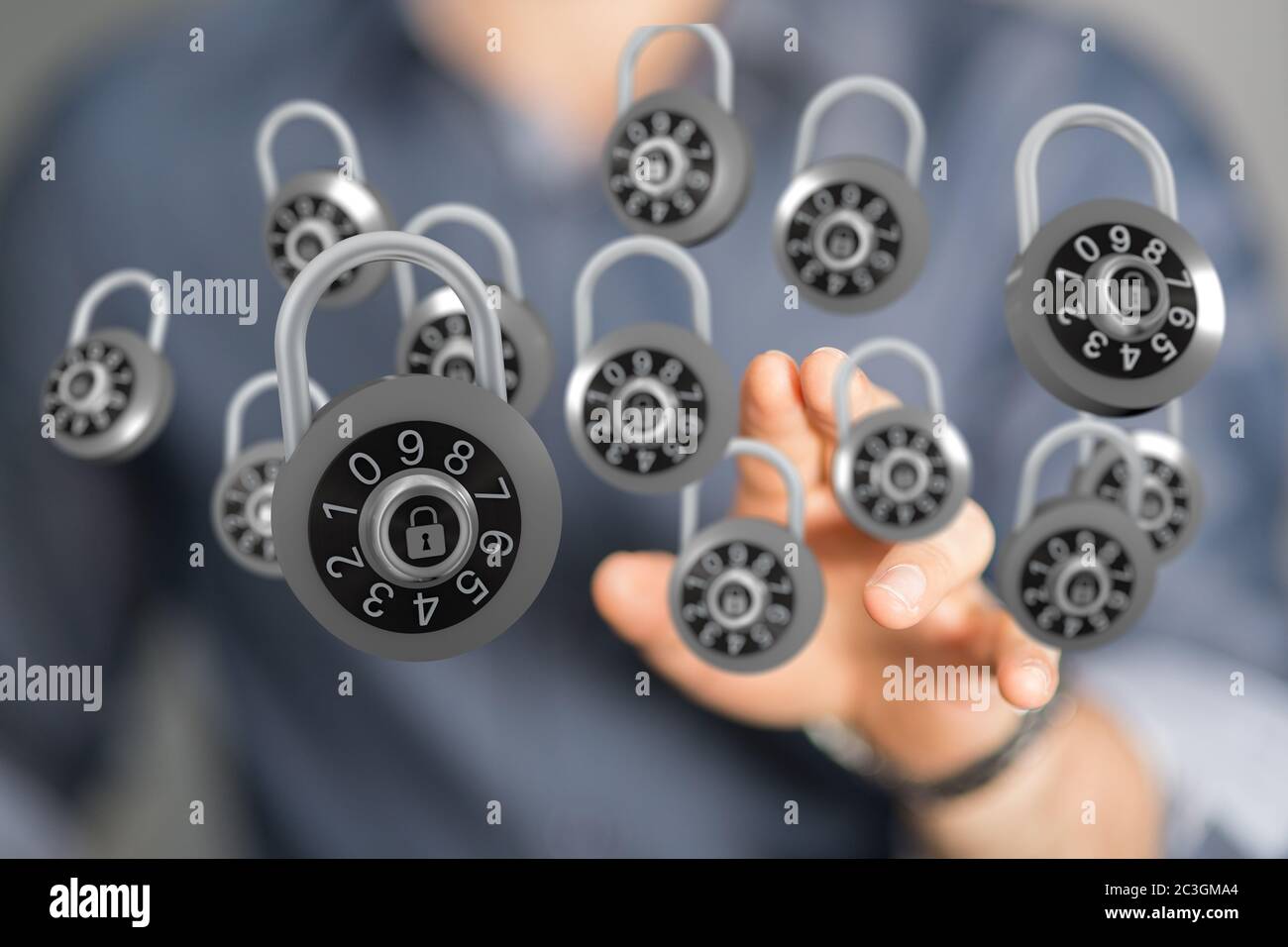 Man's hand pointing to locks floating in the air Stock Photo - Alamy