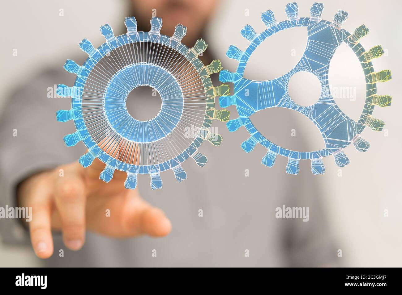 Man pointing at the illustration of the gear icon Stock Photo - Alamy
