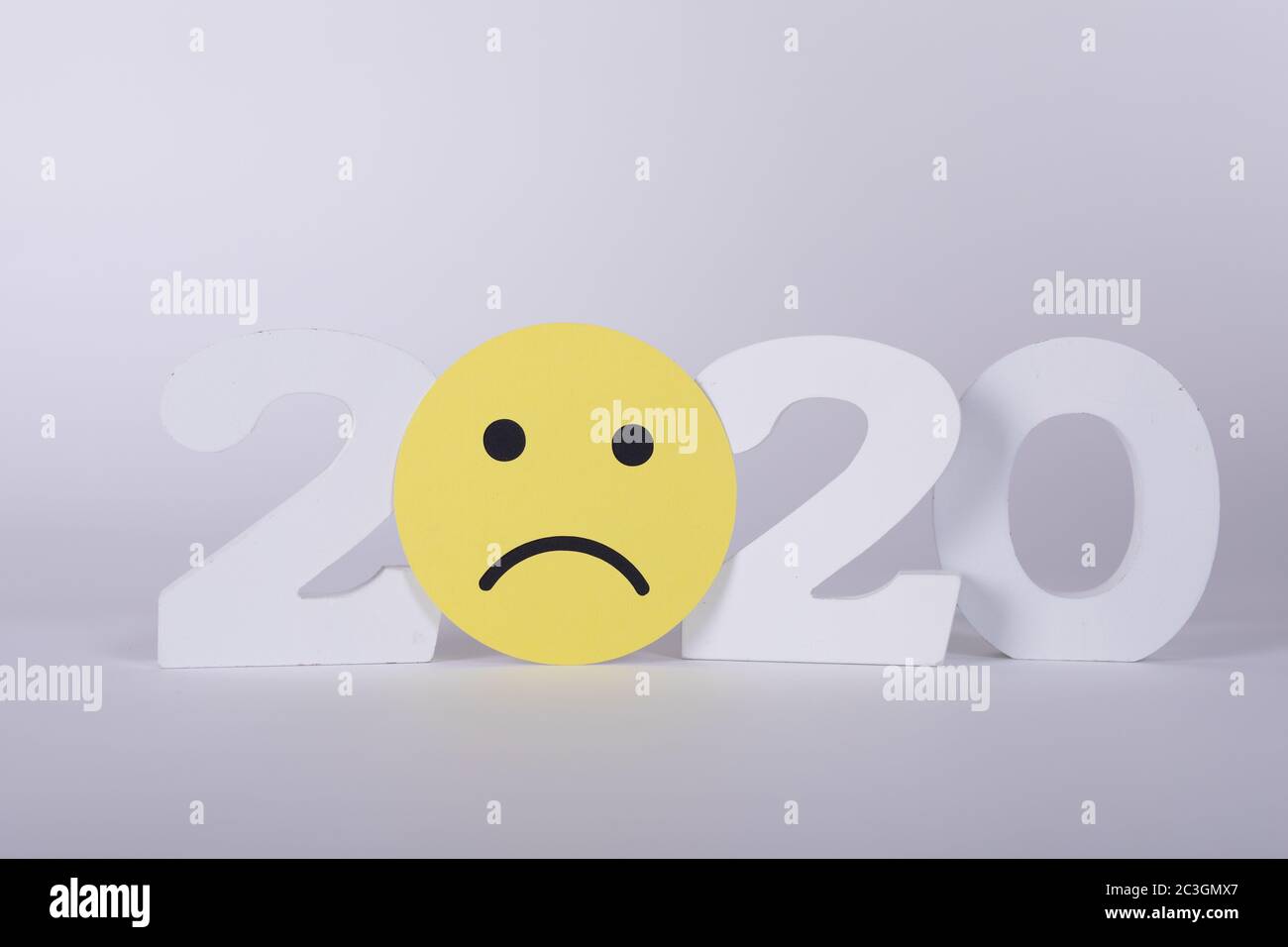 2020 with a round sad emoji-the concept of a sad year Stock Photo - Alamy