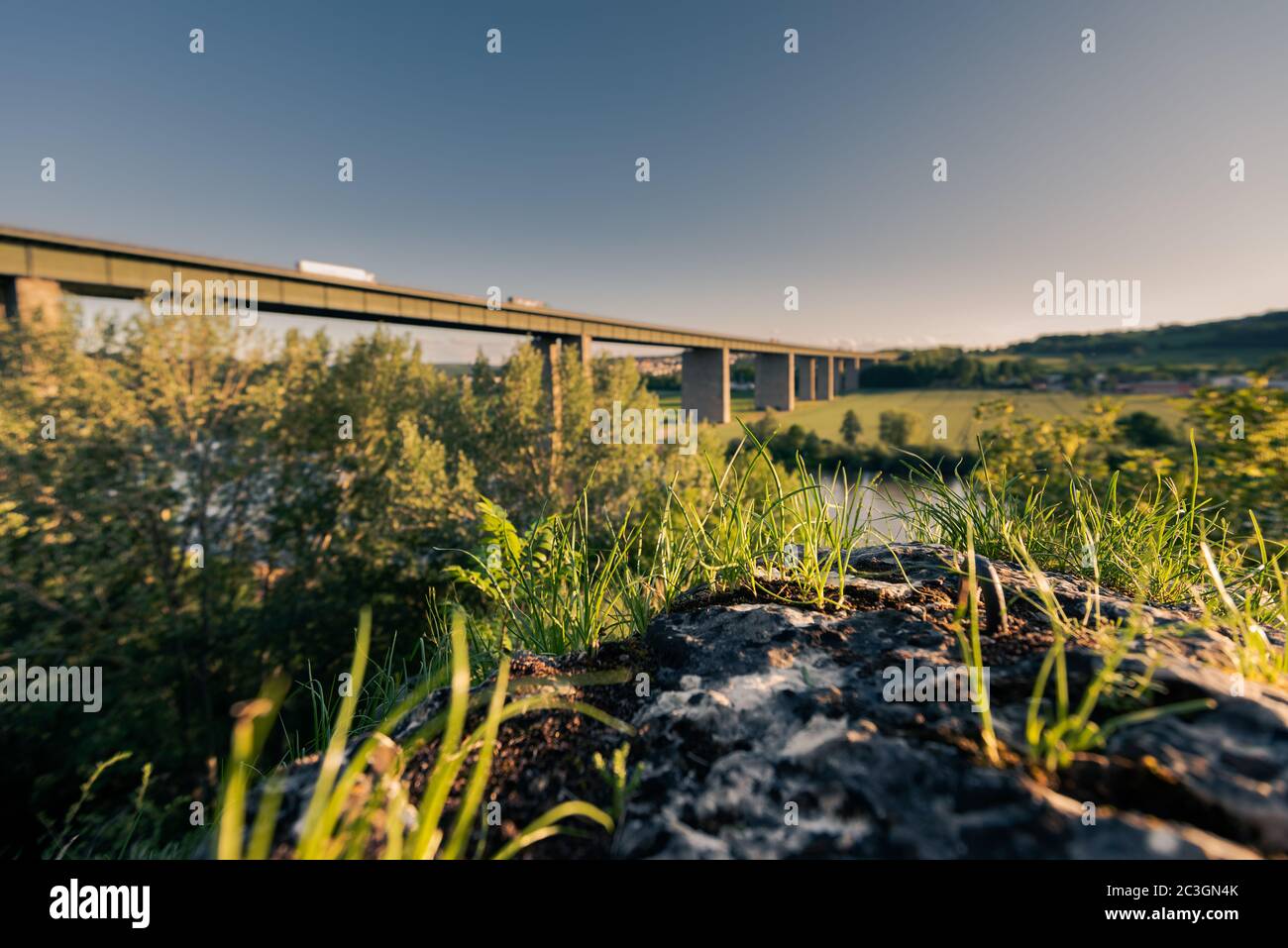 German Autobahn bridge in blurred background with natural foreground in ...