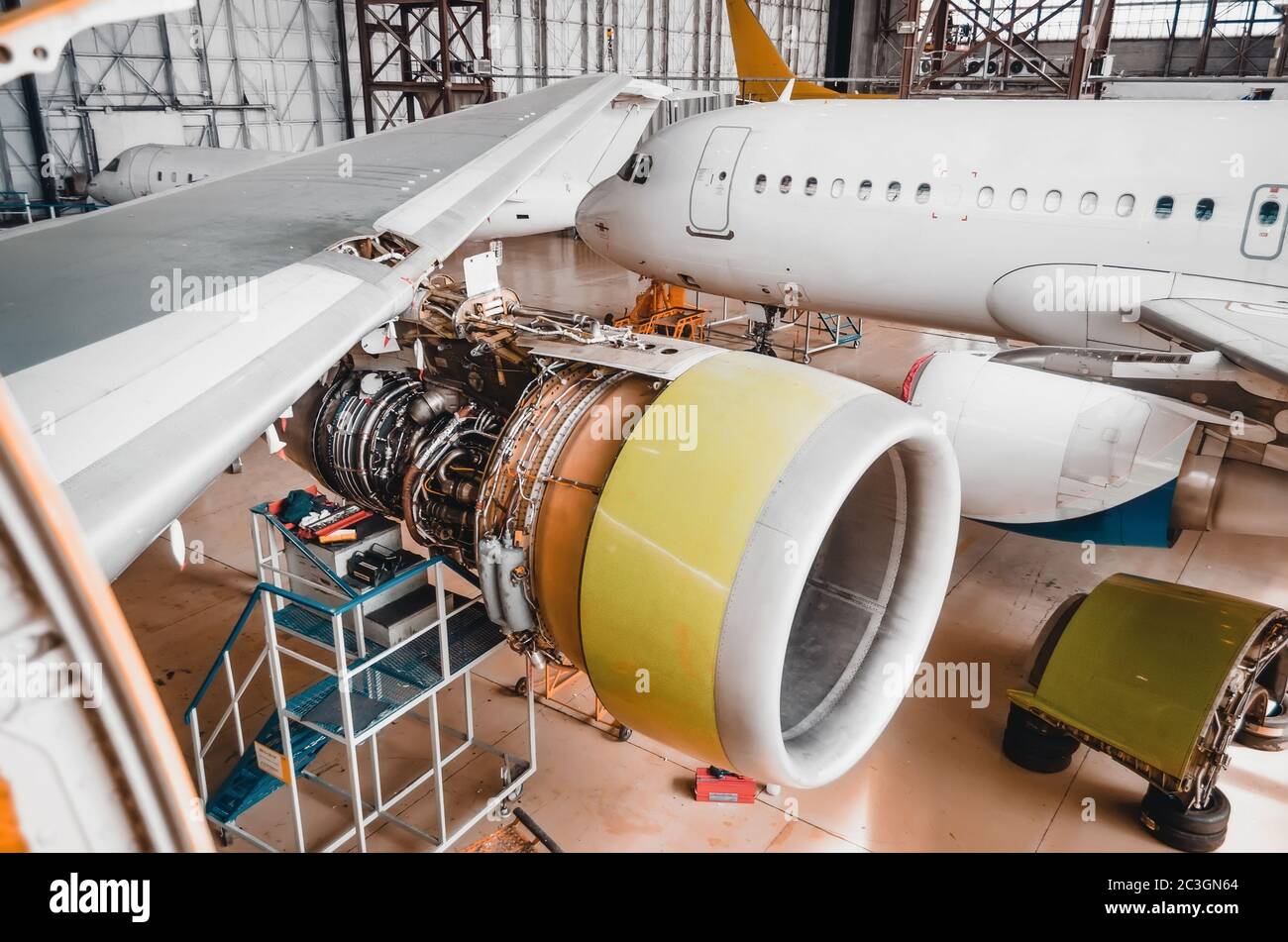 View of the wing and engine of the aircraft repair in the hangar Stock ...