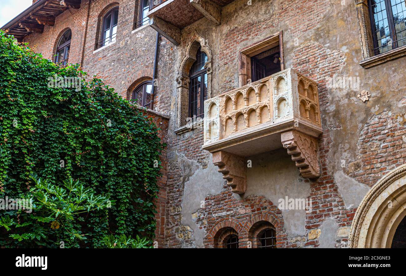 windows in the facades of ancient medieval Venetian houses Stock Photo ...