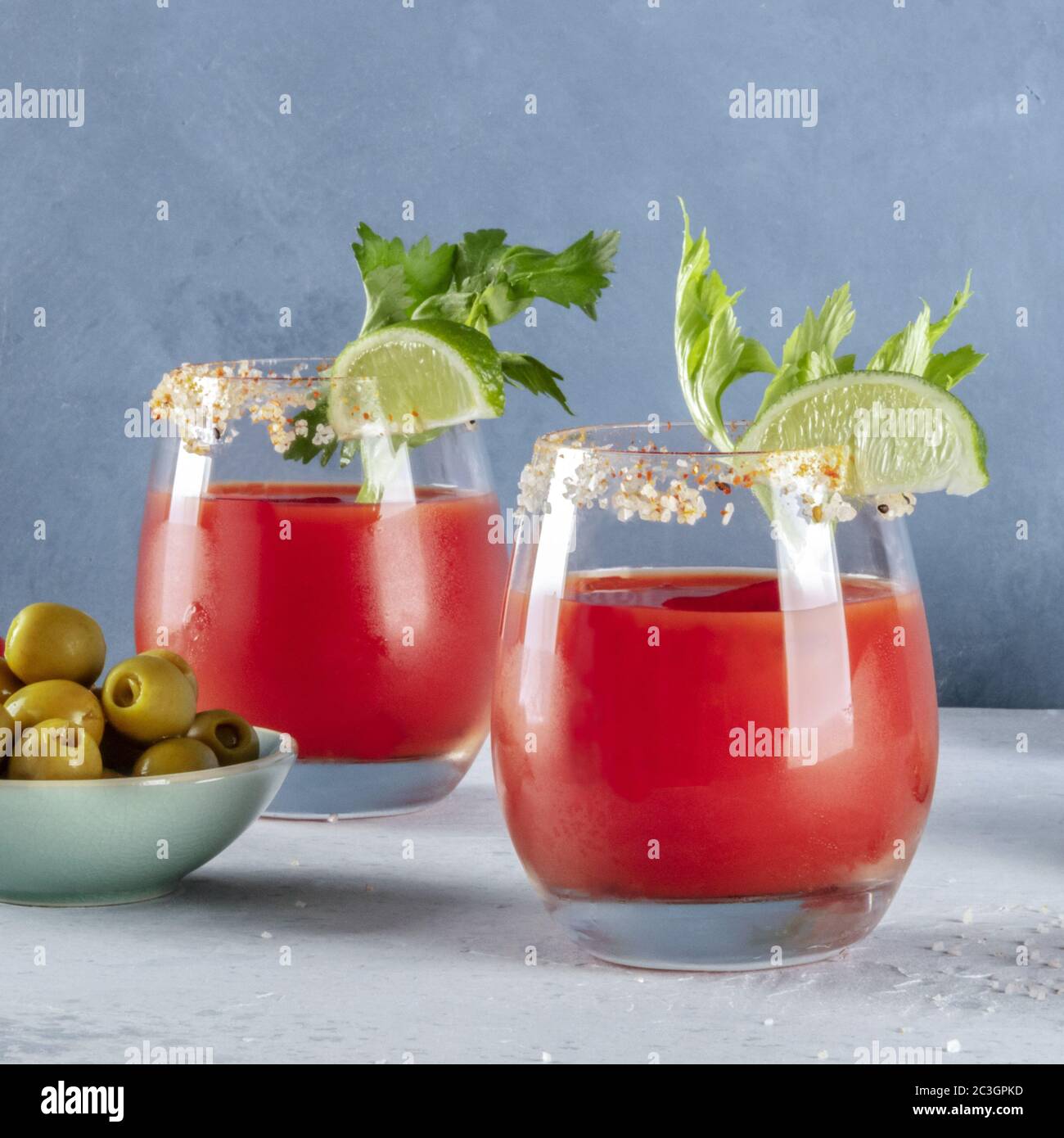 Bloody Mary cocktail with tomato juice, lime, and celery, with olives ...