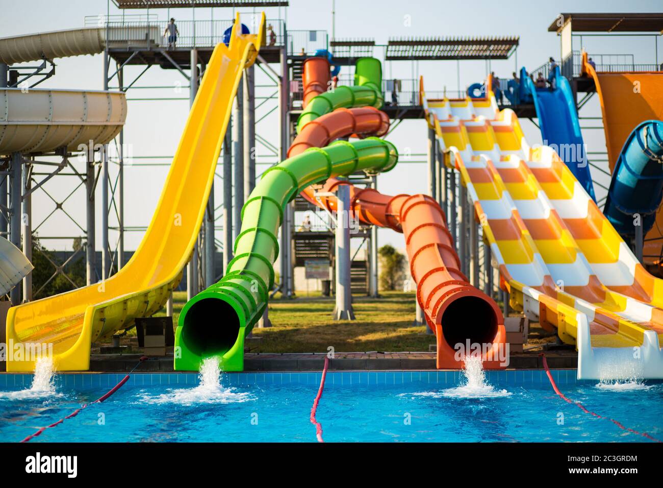 Colorful slides in outdoor water park in summer resort Stock Photo - Alamy