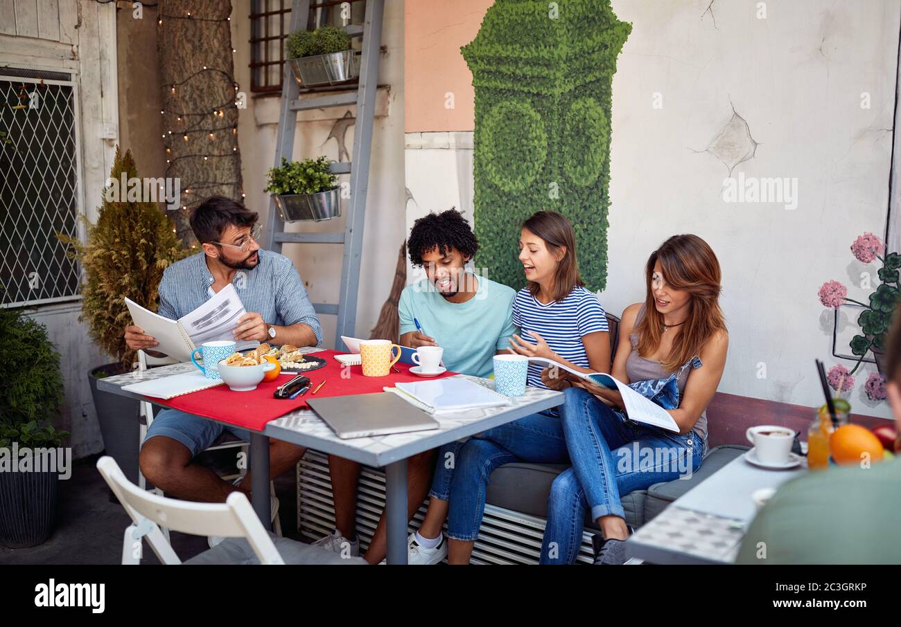 Group of young students study together with the coffee and snacks in ...