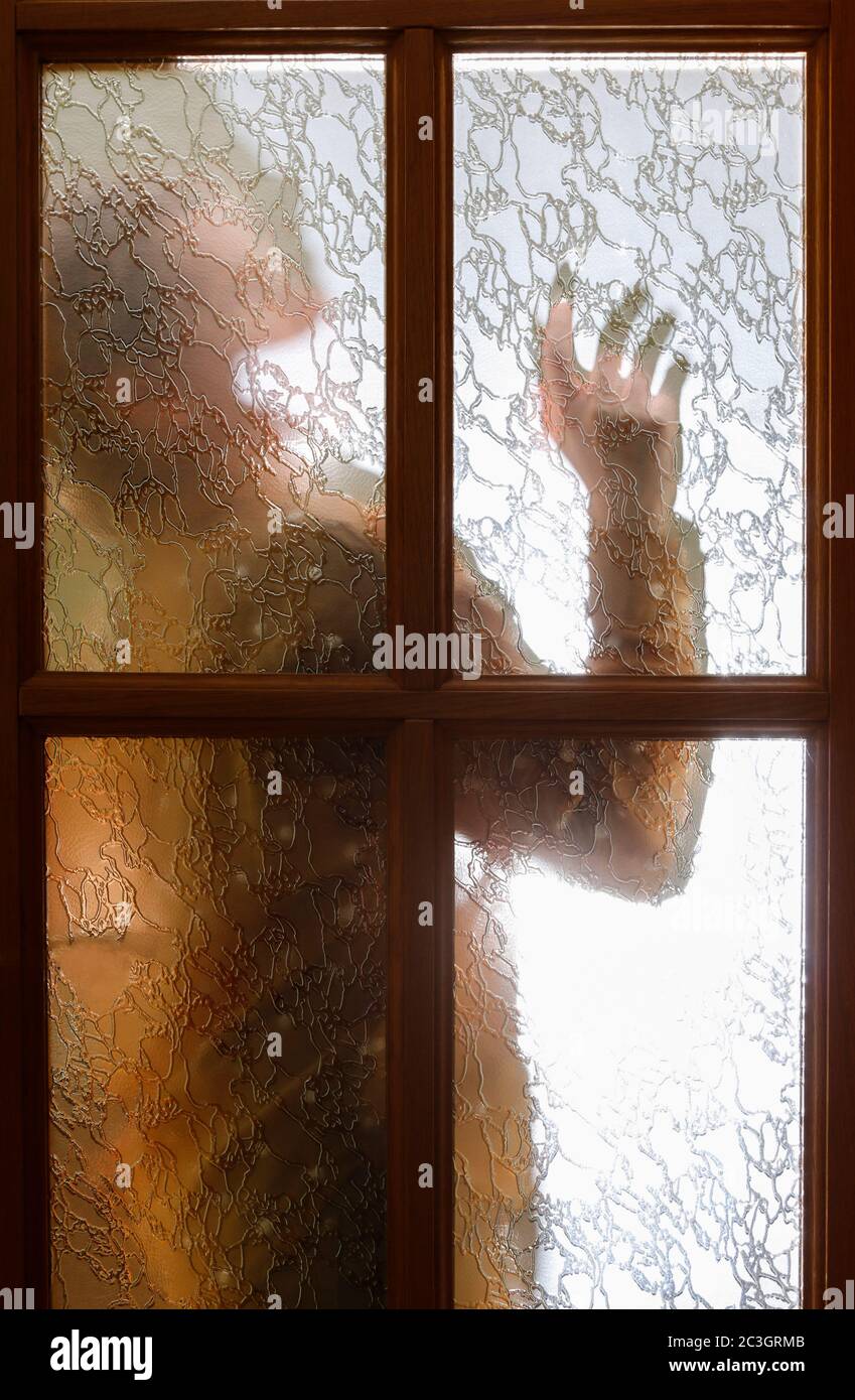 Shadow behind glass door hi-res stock photography and images - Alamy