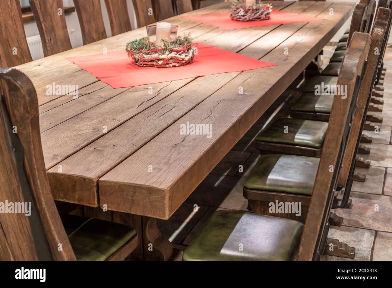 Huge solid wood table made of real wood with matching chairs in a ...