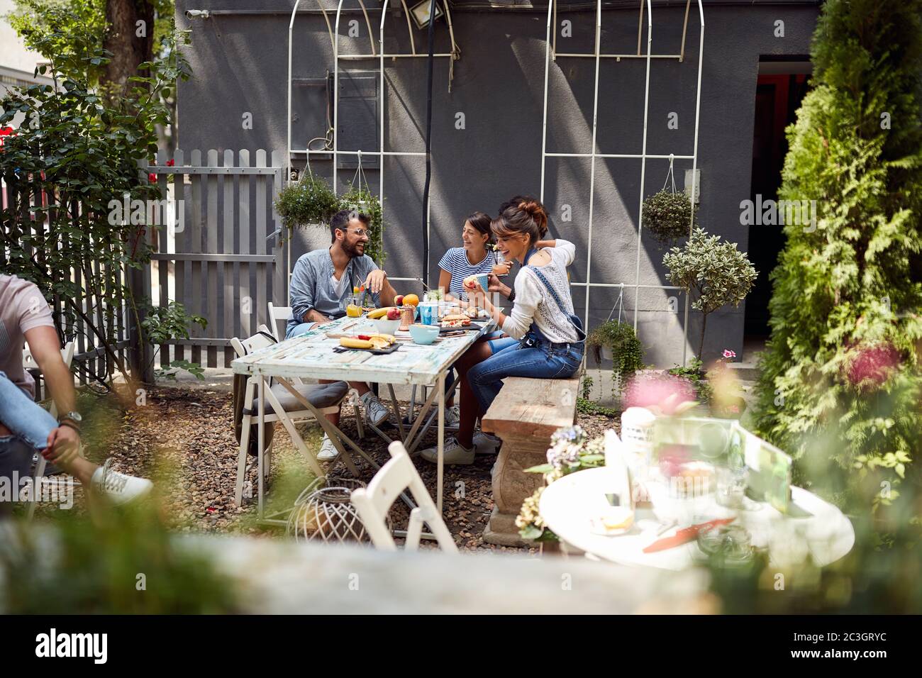 Young people enjoy food, drink and lovely conversation at beautiful ...