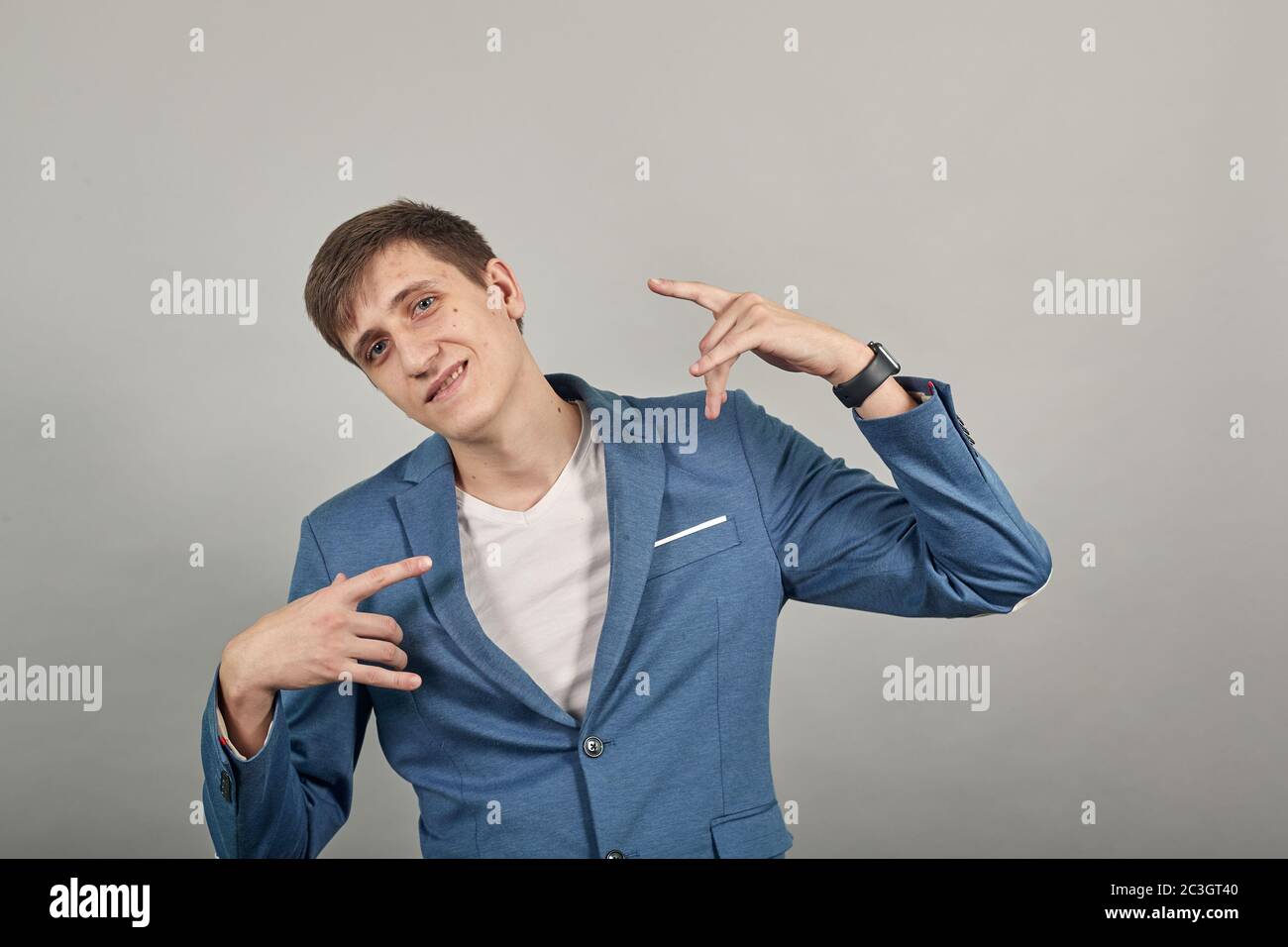 Giving rock and roll sign, showing symbol of the horns, gestures with ...