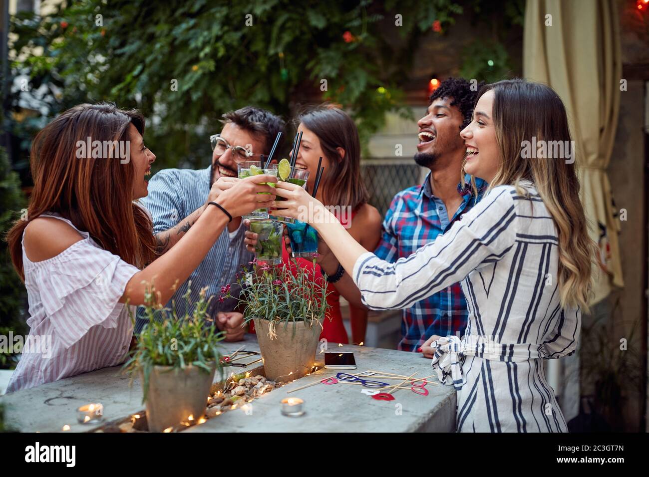 Group of young people make a toast at a party Stock Photo - Alamy