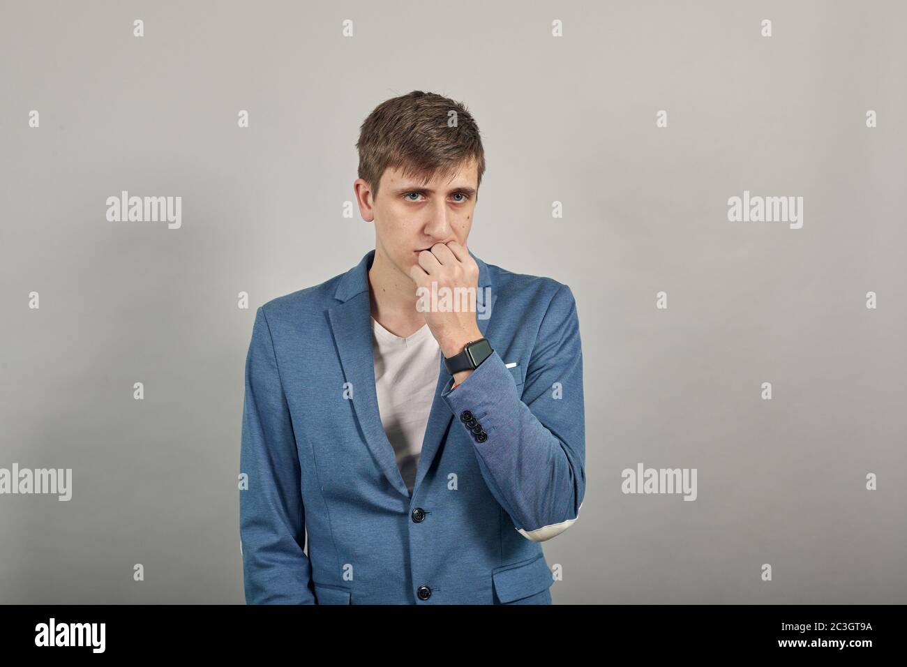 Man biting knuckle hi-res stock photography and images - Alamy