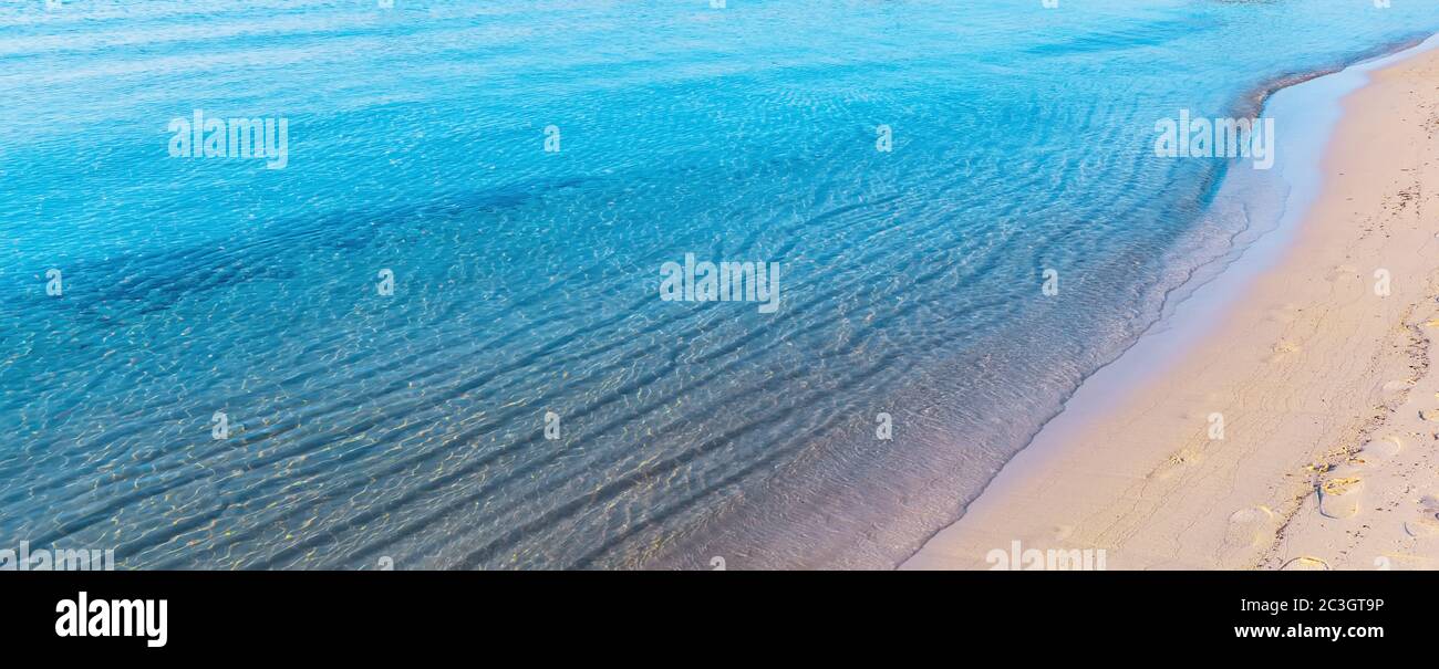 Sandy beach and sea water edge Stock Photo - Alamy