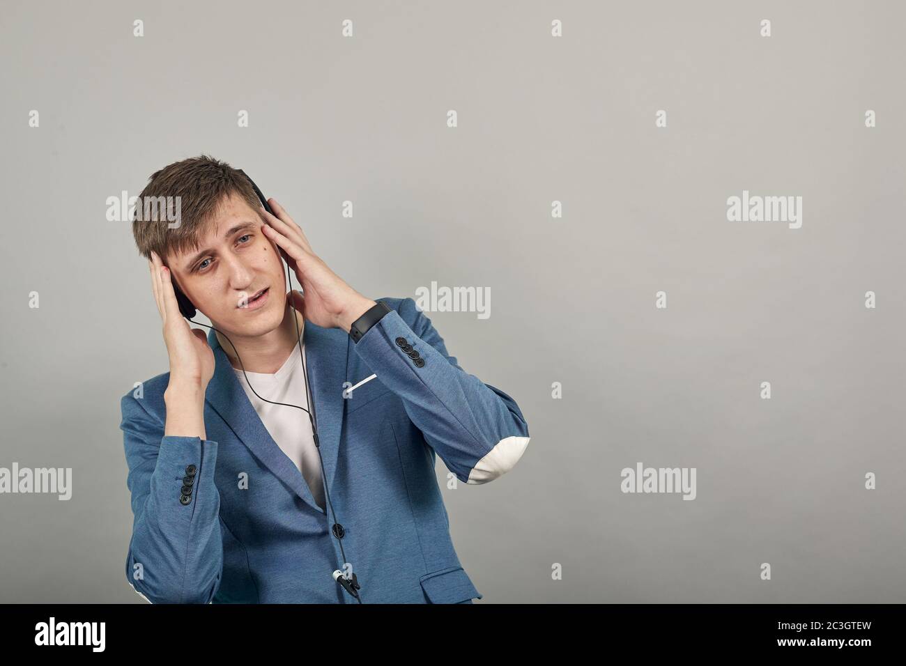 Listens to music on headphones and singing, earphones dancing with hair ...