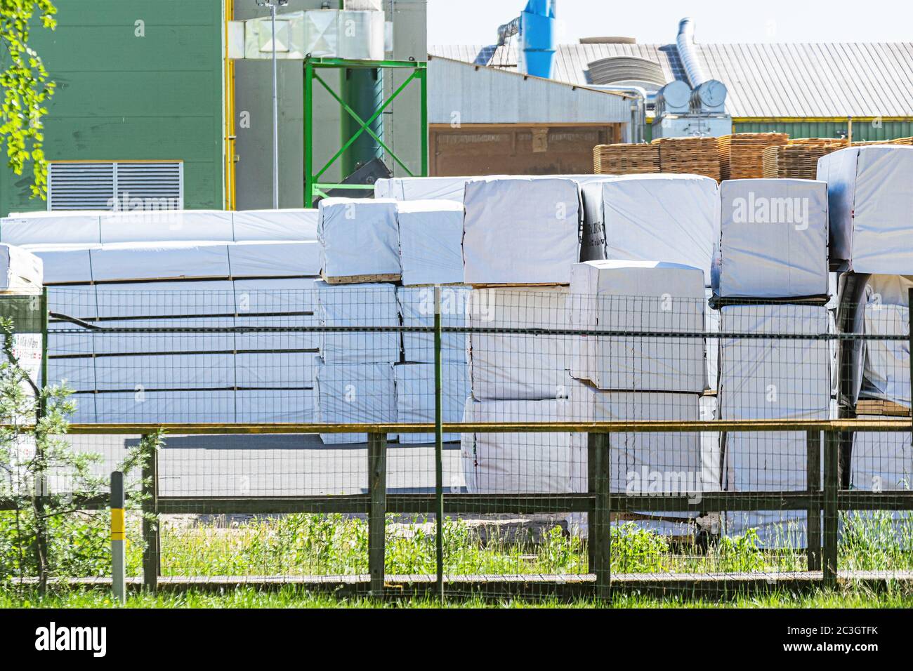 Rows of white packed boxes with materials or finished products in an ...