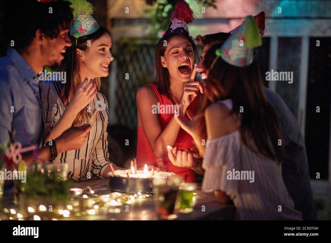 Young people celebrate a birthday and enjoy childish games Stock Photo ...